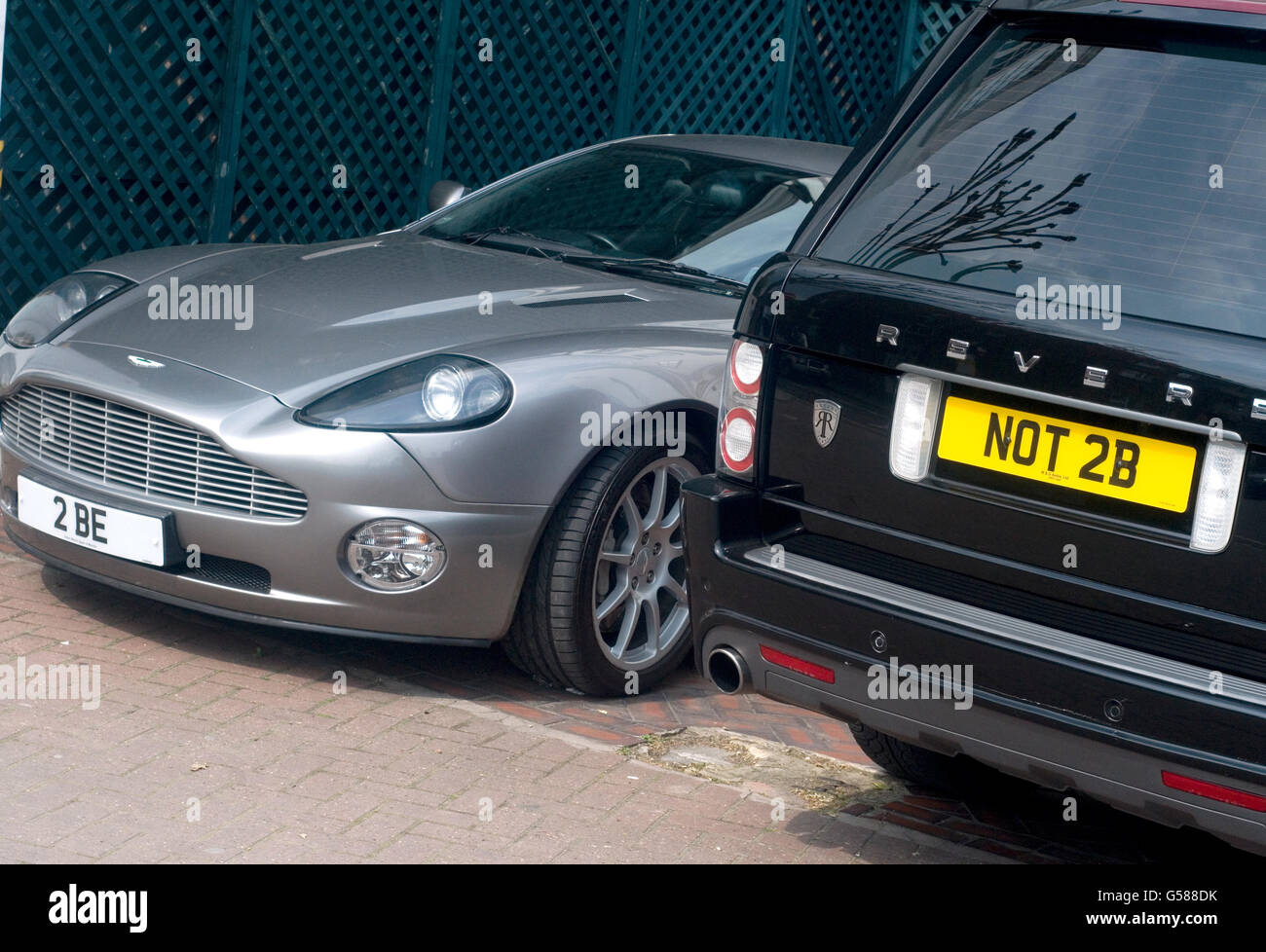 Two cars with registration plates reading '2 BE' and 'NOT 2B' in ...
