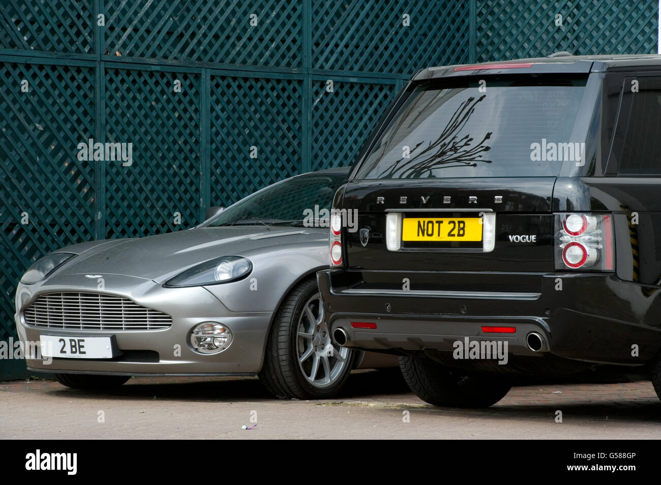Two cars with registration plates reading '2 BE' and 'NOT 2B' in ...