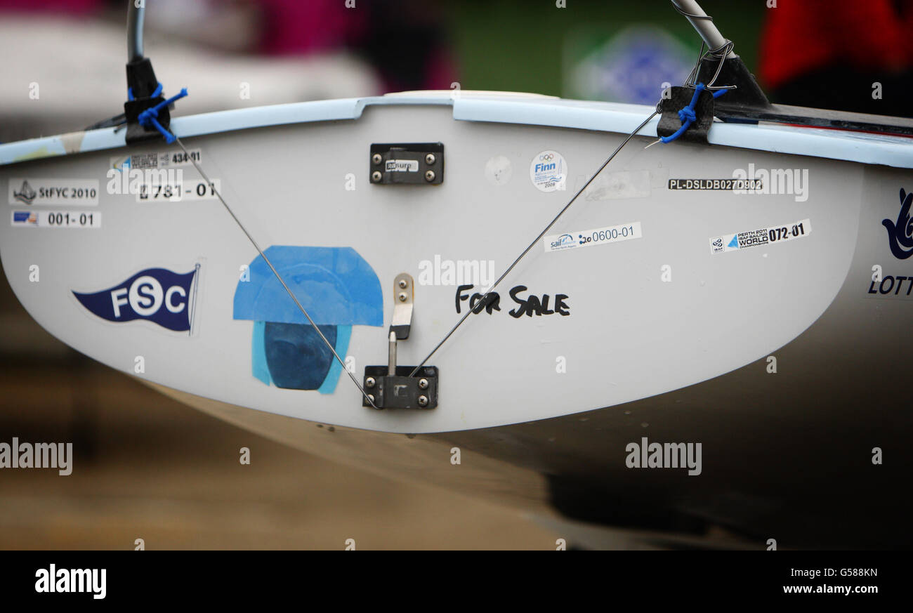 'For Sale' written of the stern of British Finn sailor Ed Wright's boat ...