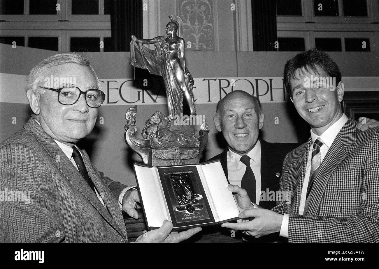 Chairman of Ford Europe, Walter Hayes (L) presenting the 1988 Segrave ...