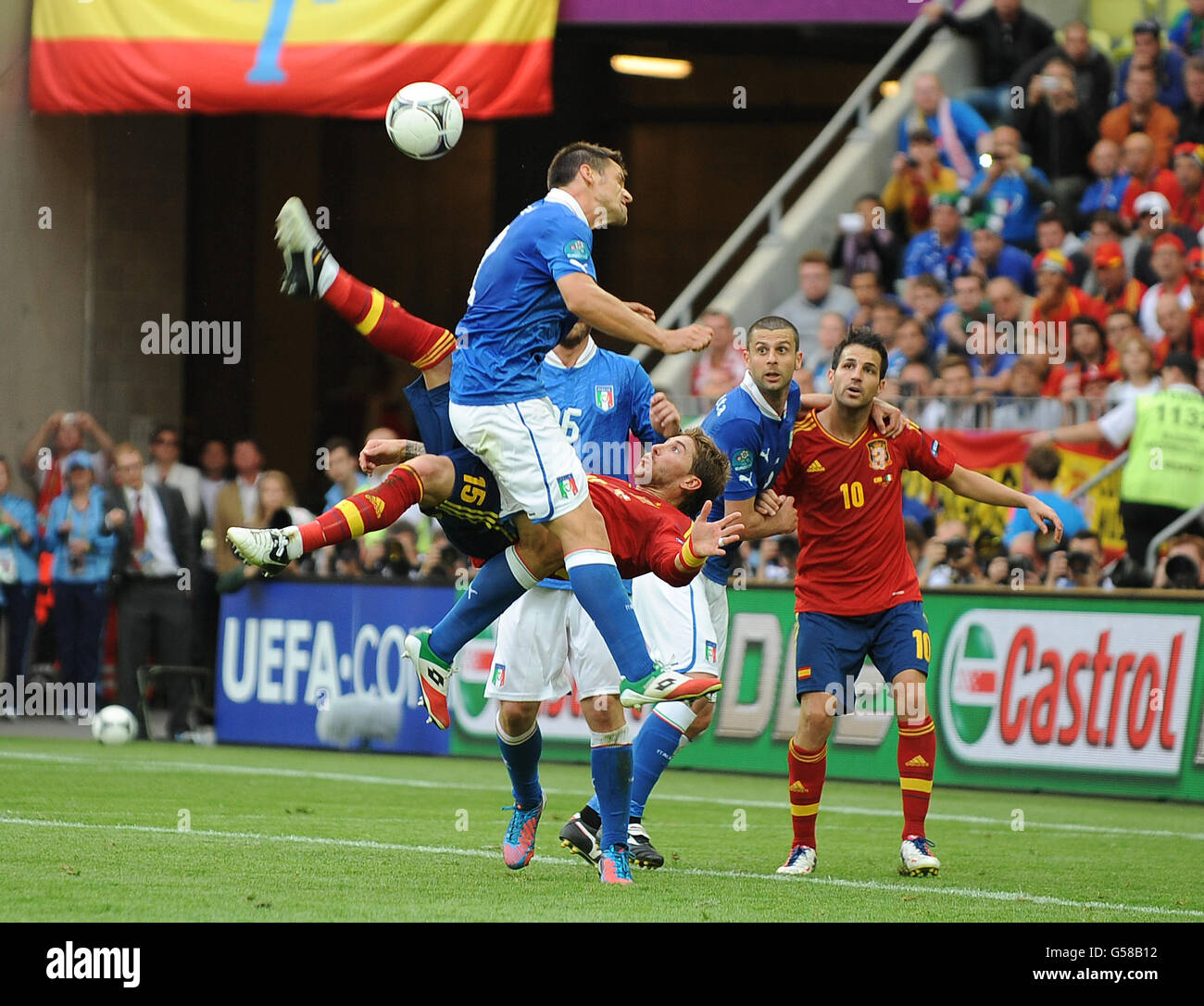 Spains Sergio Ramos attempts an overhead kick as he is tackled by Italy ...