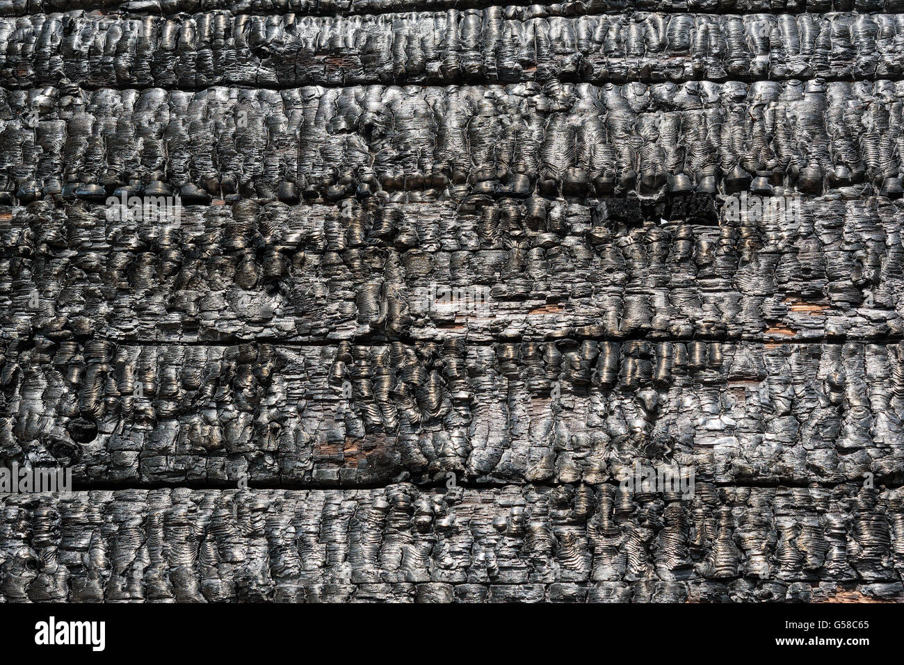 Burnt wooden wall background texture Stock Photo - Alamy