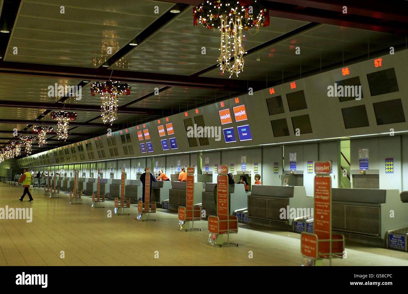EasyJet check-in desks at Luton airport stand empty, following three ...