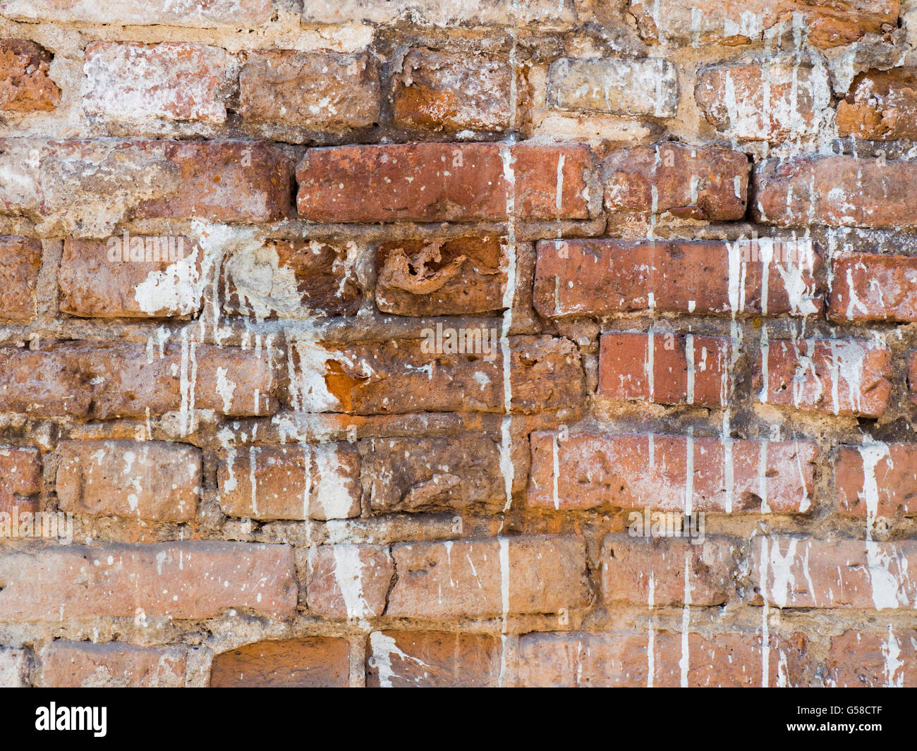 Red old brick white painted wall texture background Stock Photo - Alamy