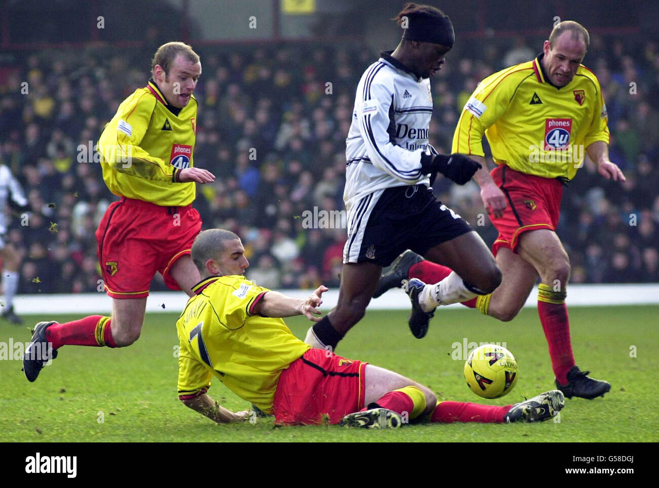 Fulham's Louis Saha (C) carves his way past Watford's (left to right ...