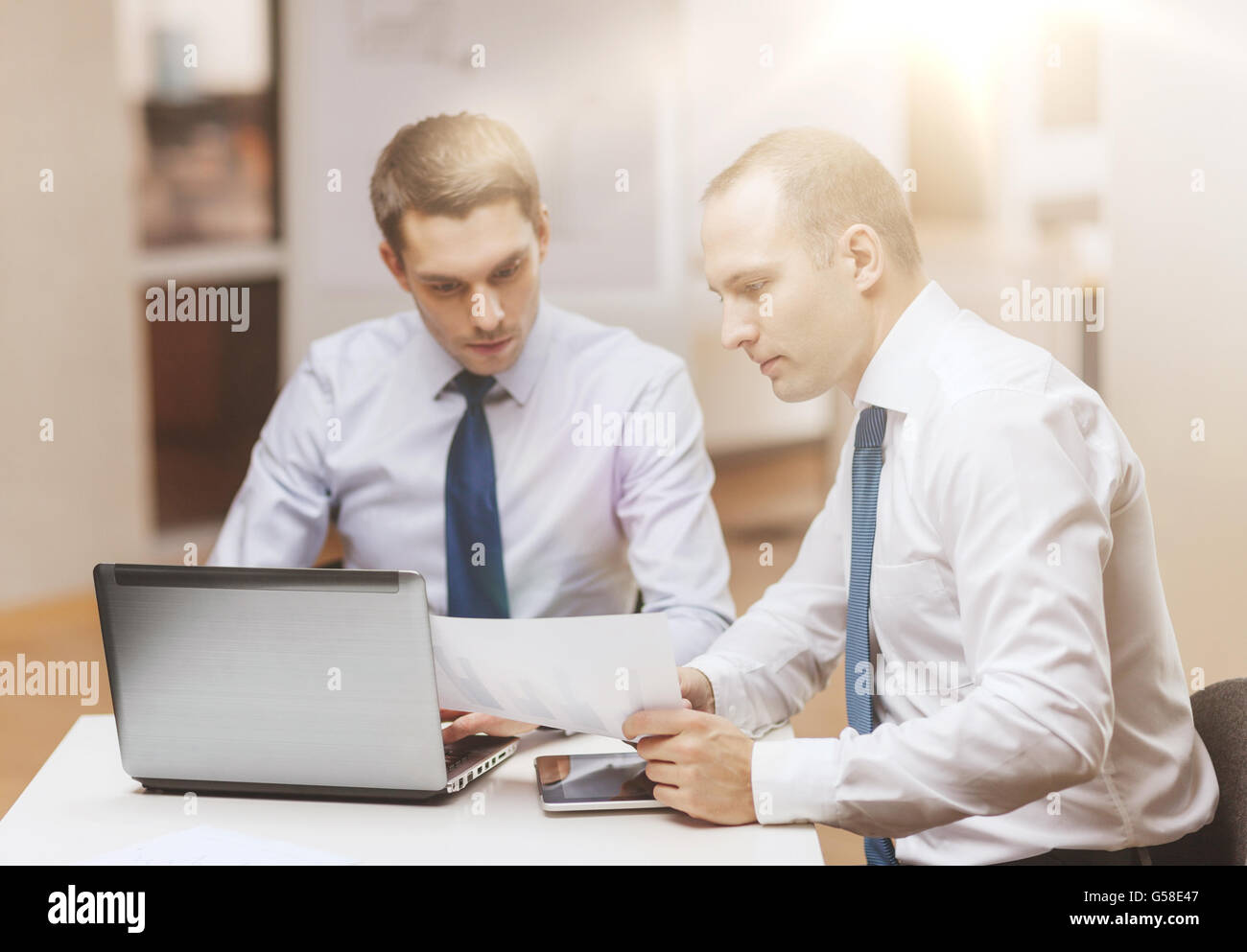 two businessmen having discussion in office Stock Photo - Alamy
