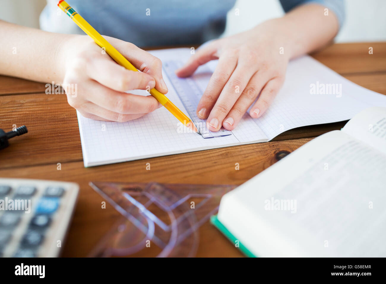 close up of hands with ruler and pencil drawing Stock Photo - Alamy