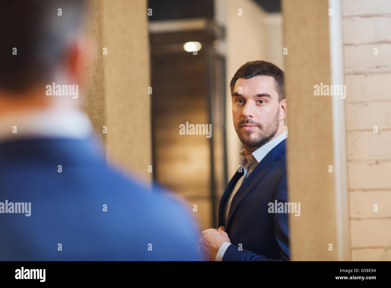 Trying on clothes store man hi-res stock photography and images - Alamy