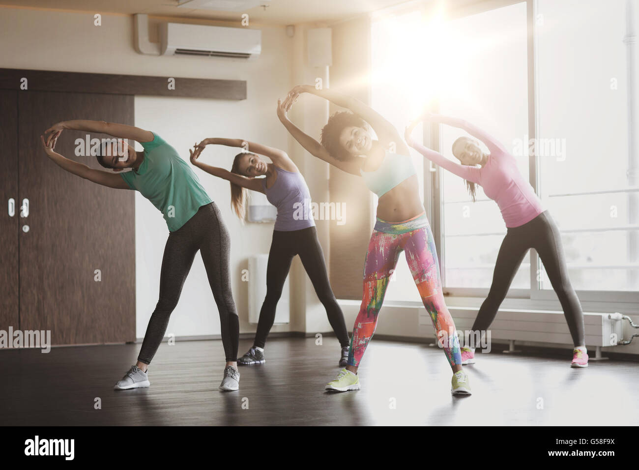 group of happy women working out in gym Stock Photo - Alamy