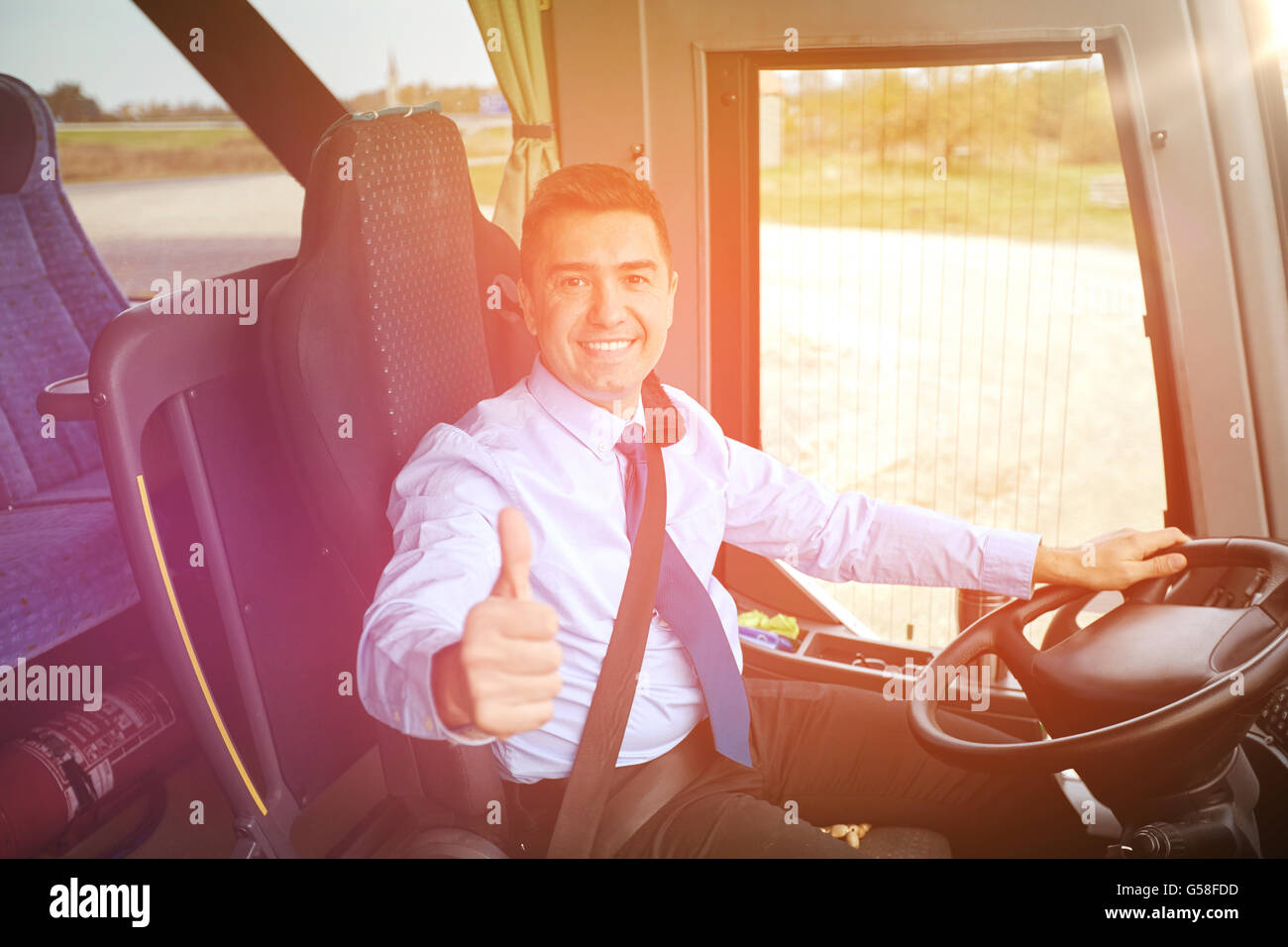 Smiling bus driver showing thumbs hi-res stock photography and images ...