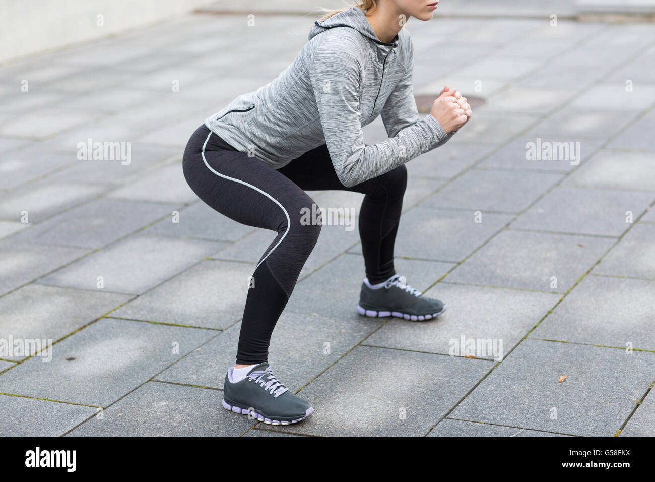 Doing squats outdoors hi-res stock photography and images - Alamy