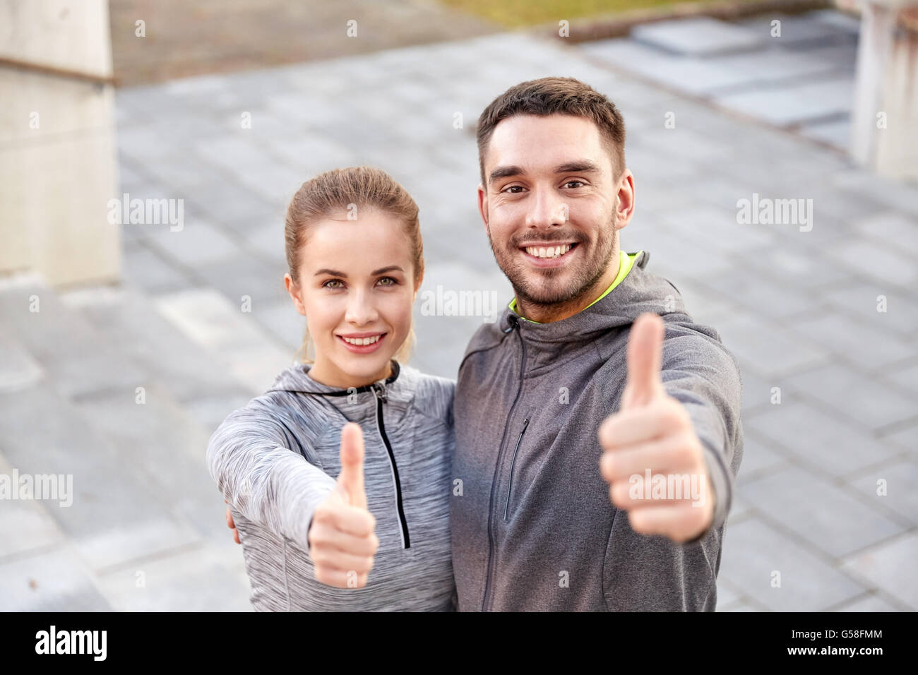 Fit couple showing thumbs up hi-res stock photography and images - Alamy