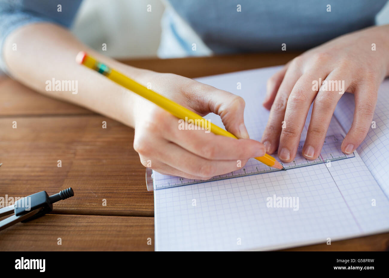 close up of hands with ruler and pencil drawing Stock Photo - Alamy