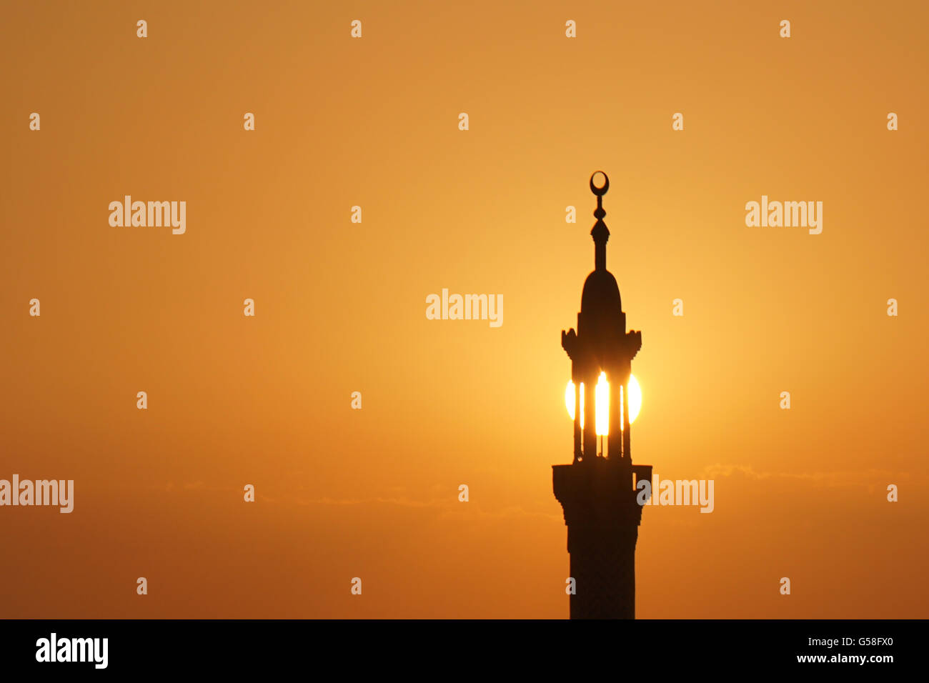 sunset over mosque in egypt town of el quesir Stock Photo - Alamy
