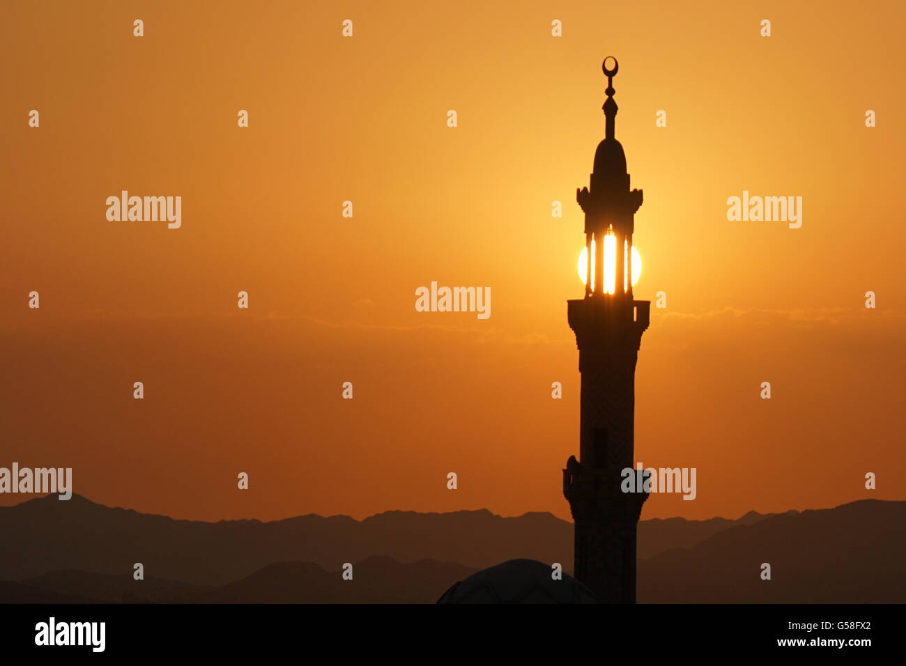 sunset over mosque in egypt town of el quesir Stock Photo - Alamy