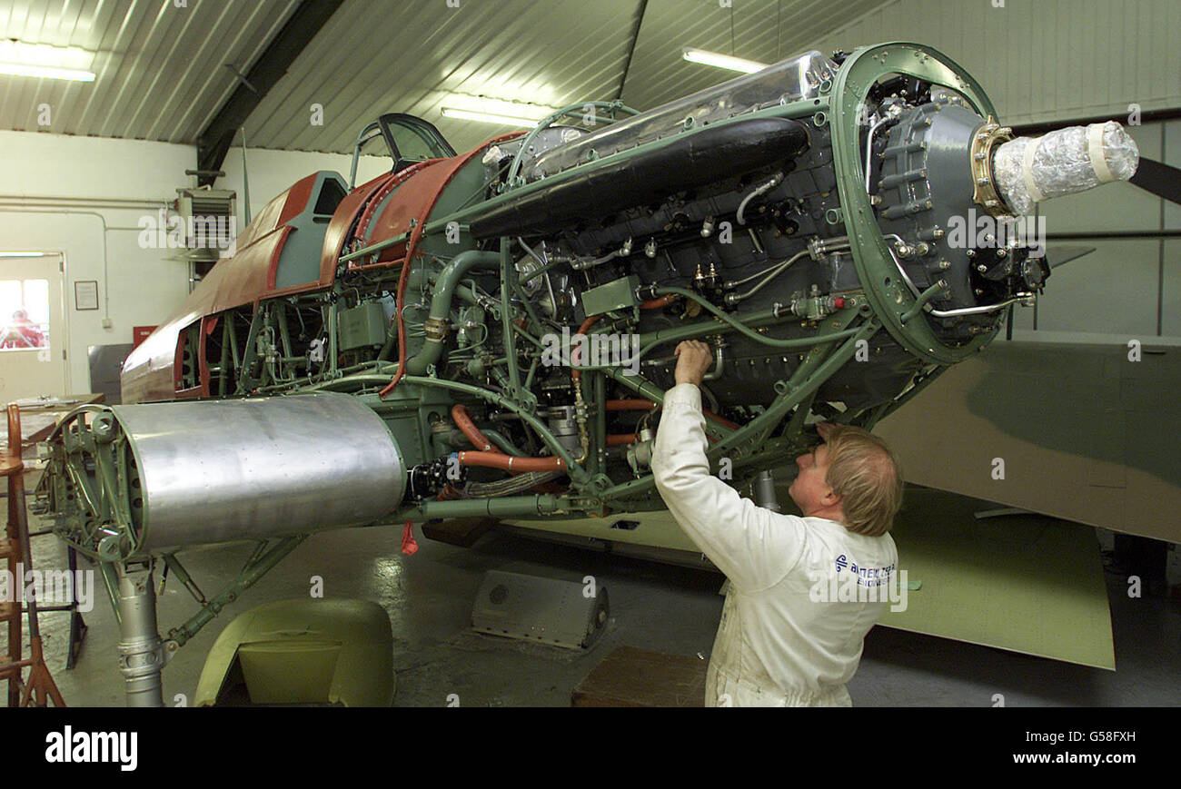 Tony Ditheridge, from Hawker Restorations, works on the Hurricane ...