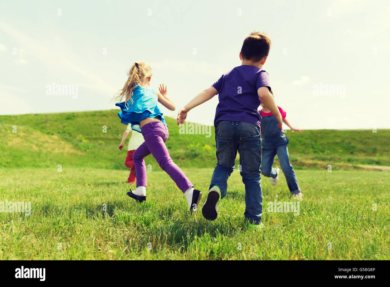 group of happy kids running outdoors Stock Photo - Alamy