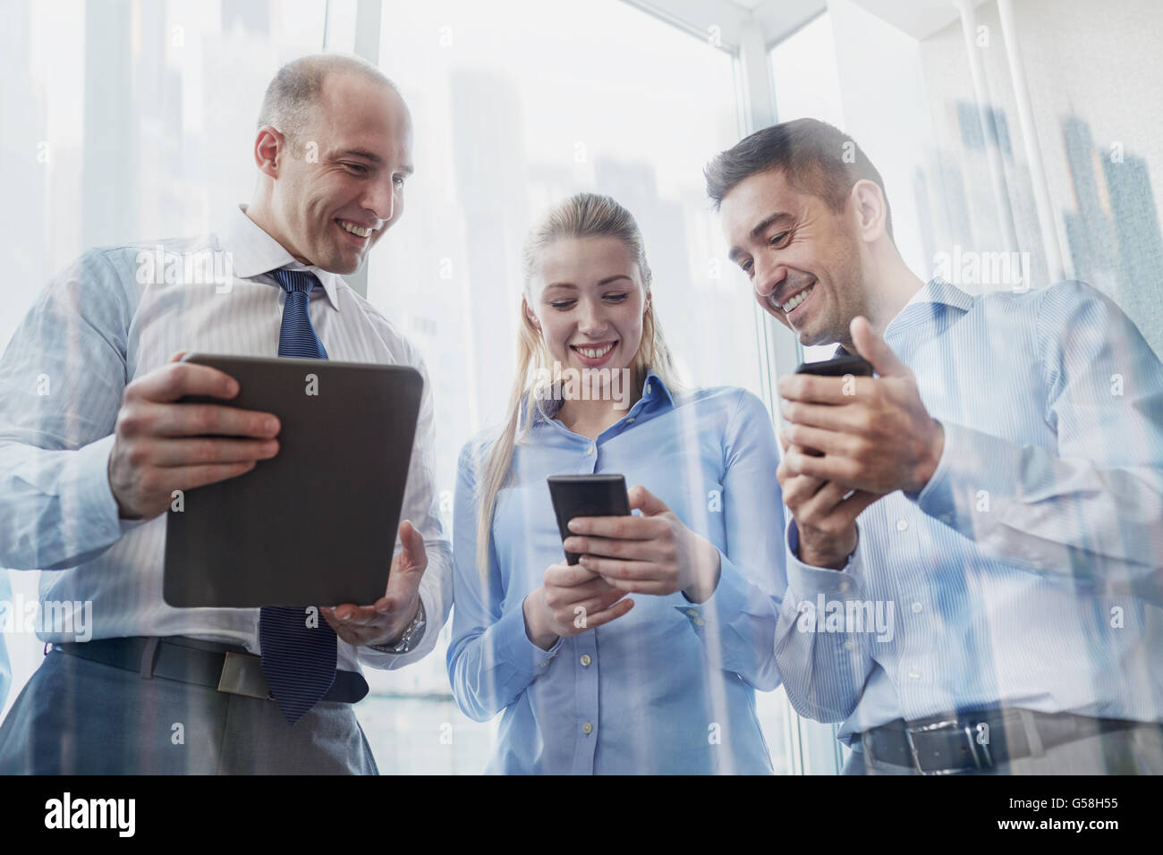 business people with tablet pc and smartphones Stock Photo - Alamy