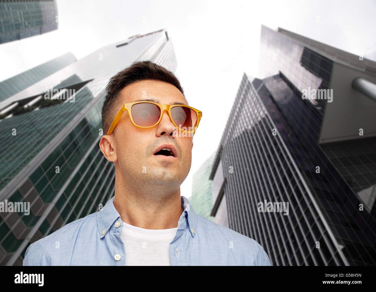 face of scared man in sunglasses over big city Stock Photo - Alamy