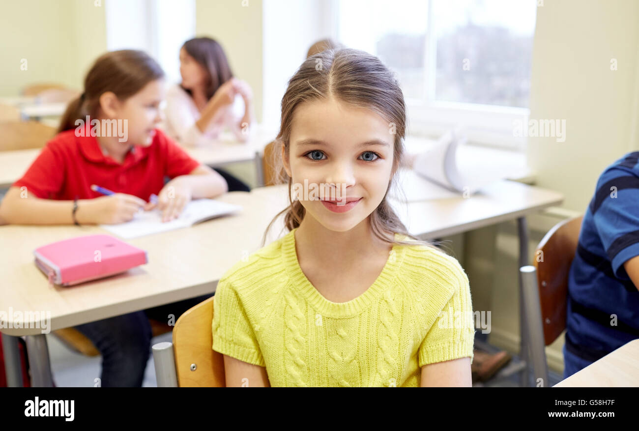 student girl with group of school kids in class Stock Photo - Alamy