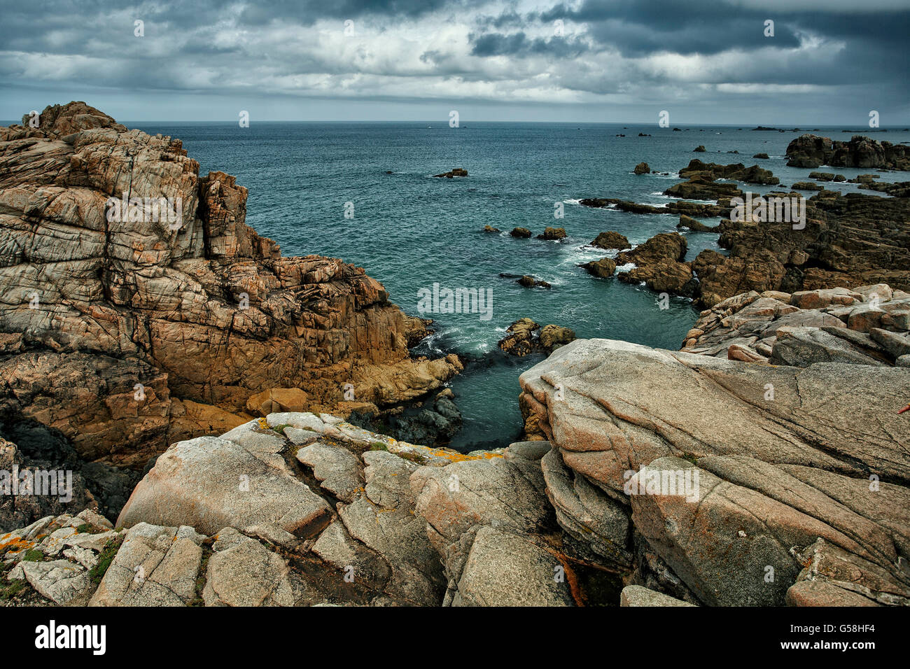 Beach and Stones at the pink Granite Coast in the Departement Cotes d ...