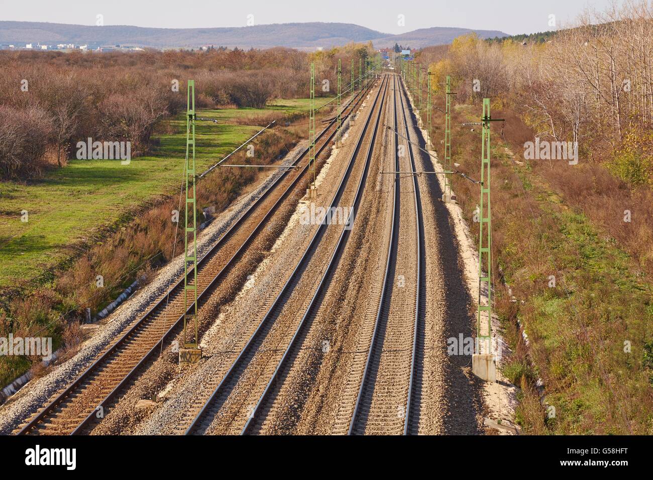 Railway tracks to the distance Stock Photo - Alamy