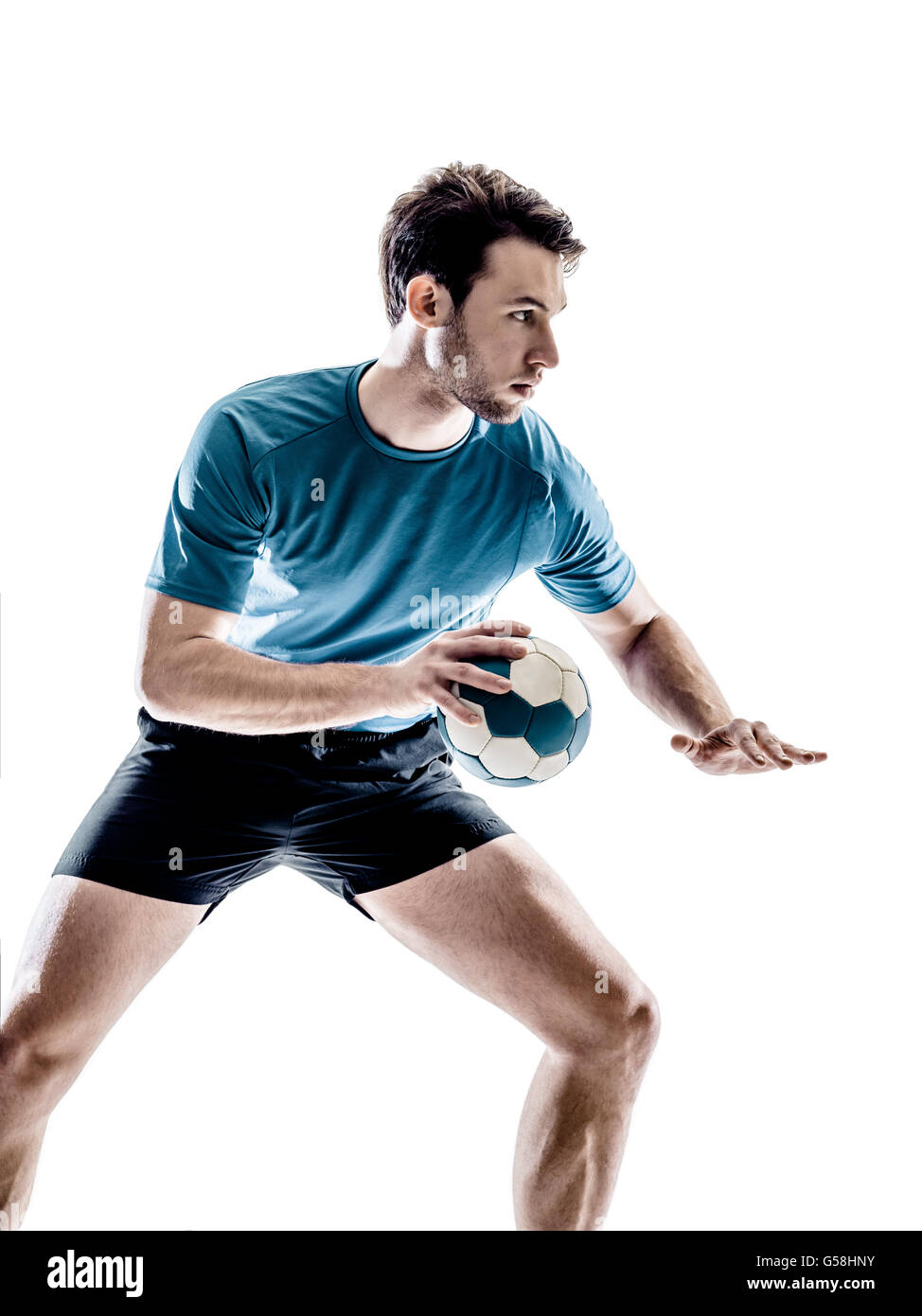 one young man handball player in studio on isolated white background ...