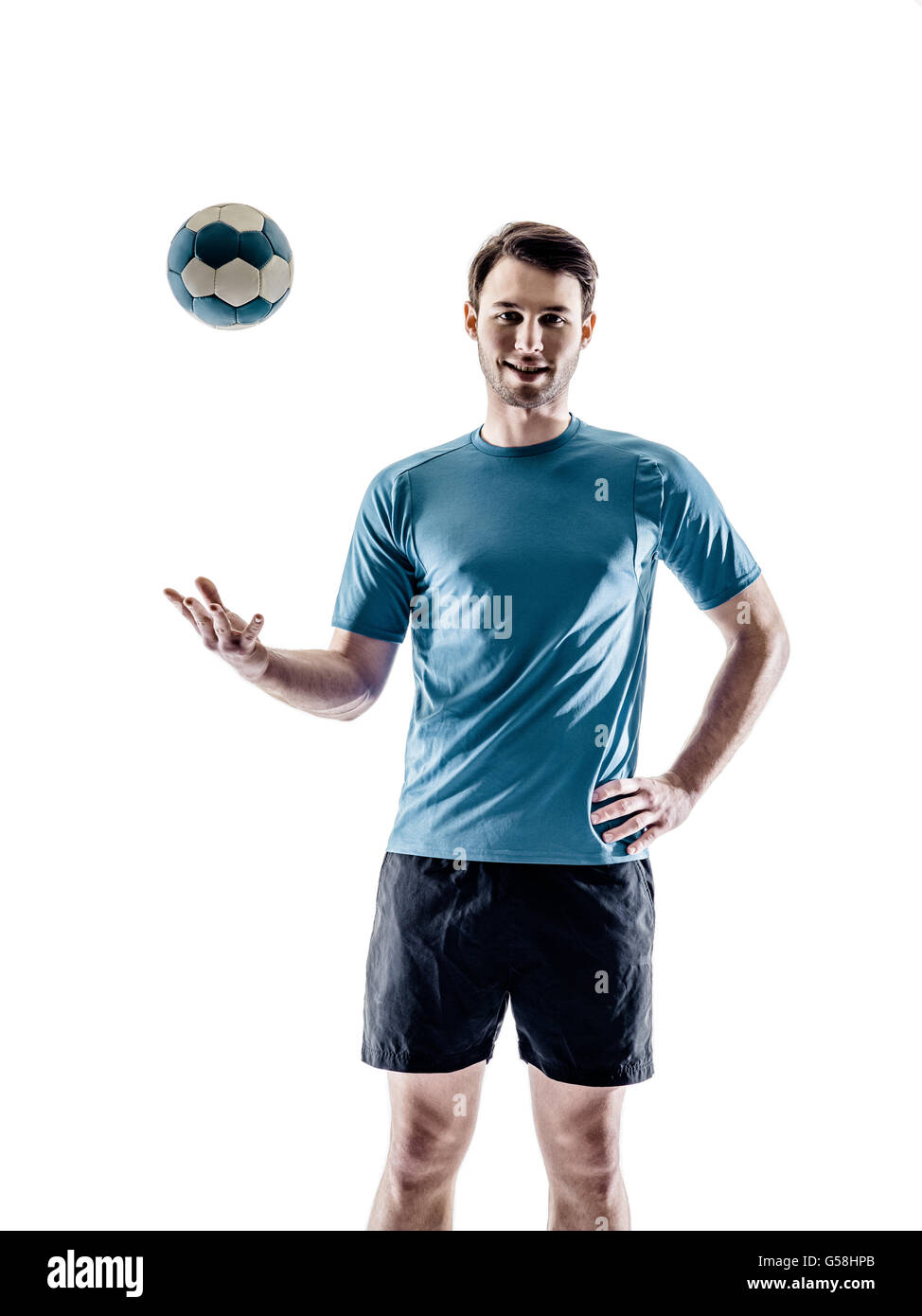 one young man handball player in studio on isolated white background ...