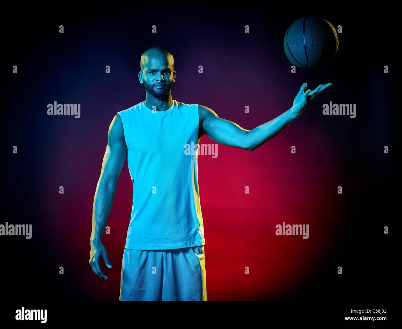 one basketball player man Isolated on black background Stock Photo - Alamy