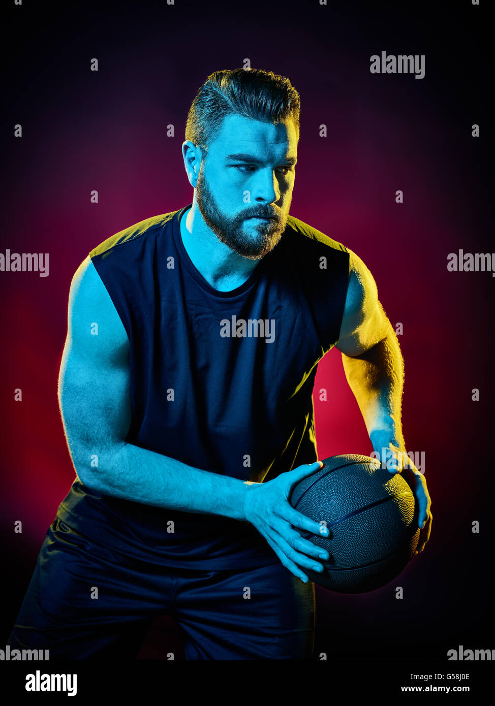 one basketball player man Isolated on black background Stock Photo - Alamy