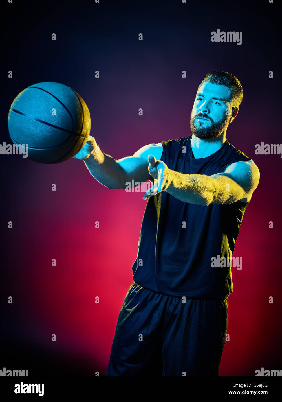 one basketball player man Isolated on black background Stock Photo - Alamy