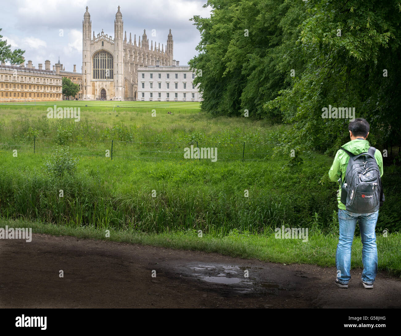 Chinese tourist takes a photograph of King's college (and, on the left ...