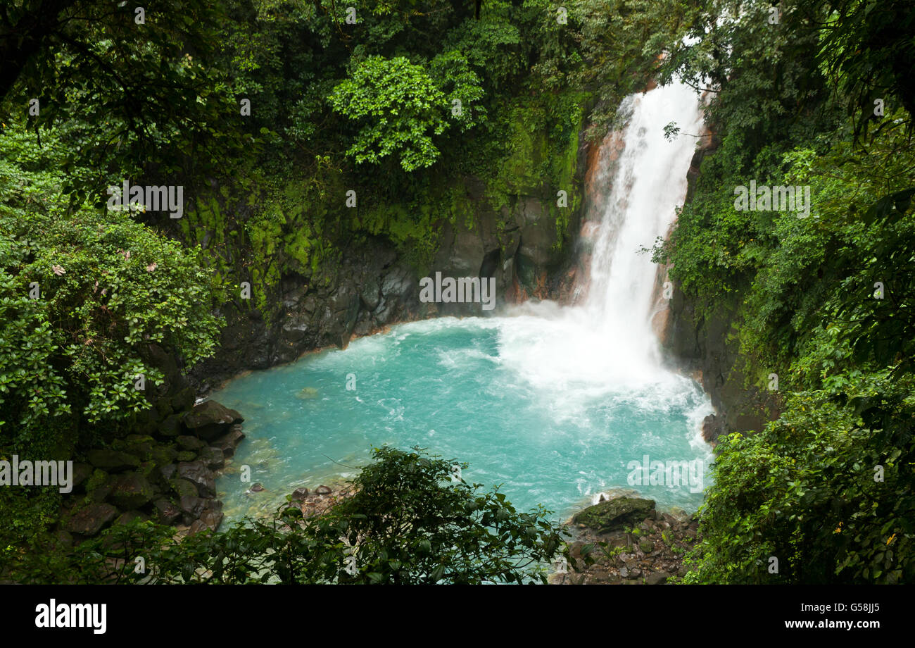 Waterfall in tropical forest Stock Photo - Alamy