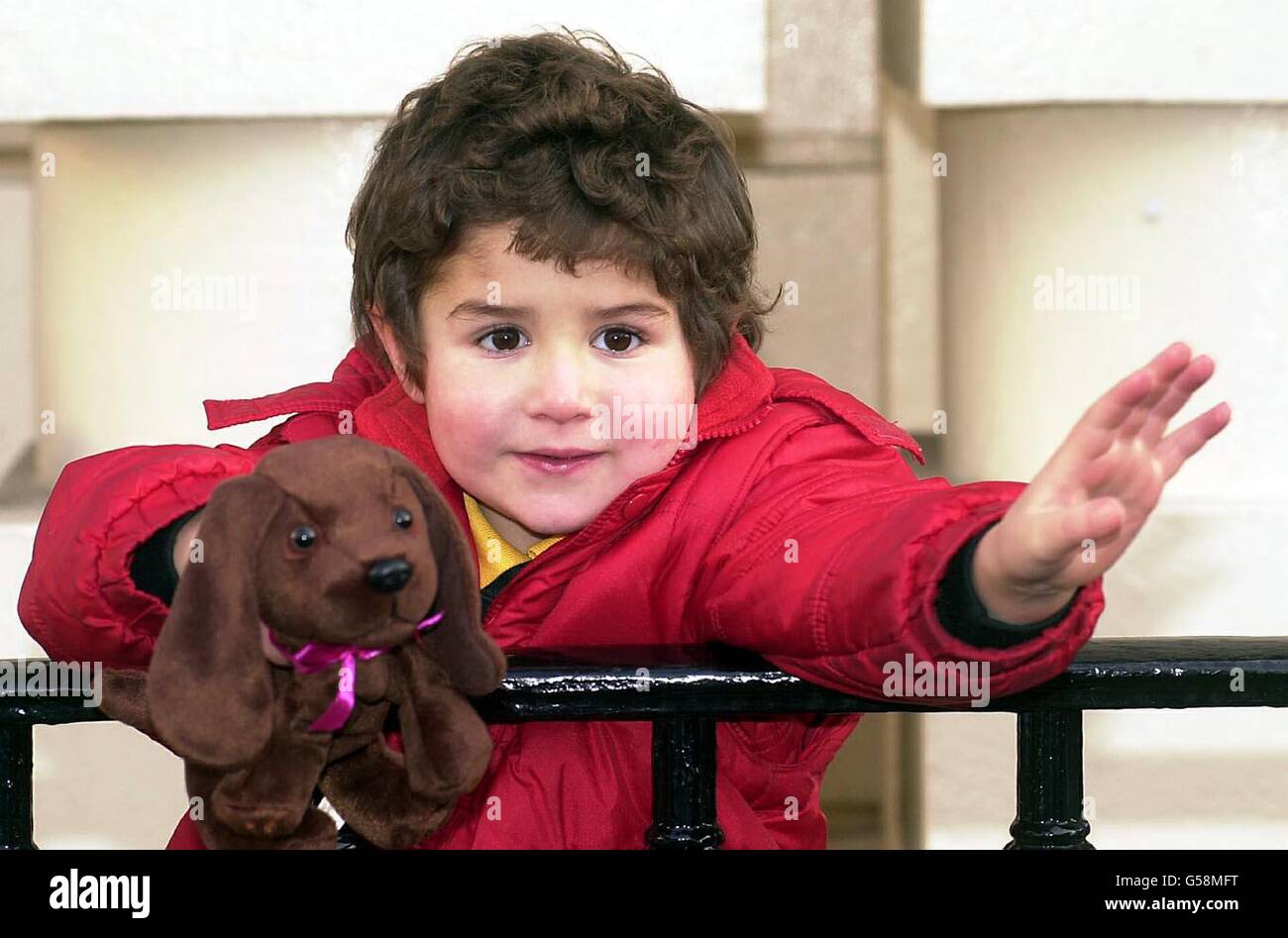 Head shoulders medical health smiling child waving toy puppy dog hi-res ...