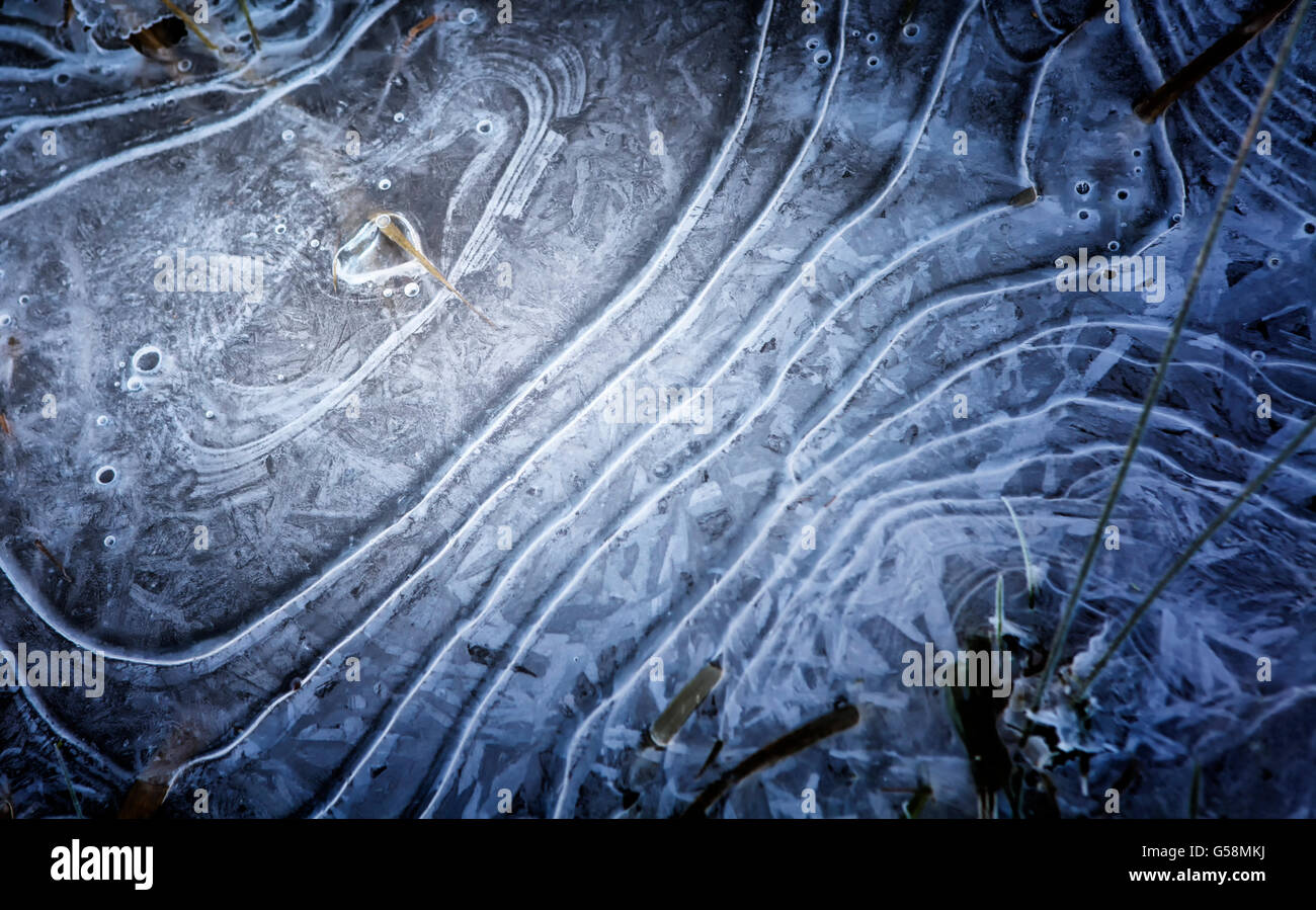 Ice Patterns in Frozen Puddles Stock Photo - Alamy