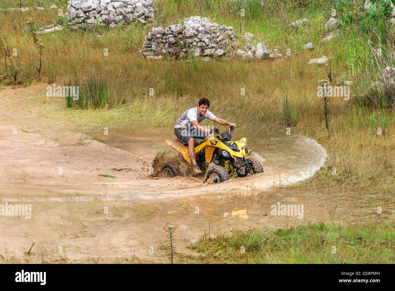 Man on quad with helmet hi-res stock photography and images - Alamy
