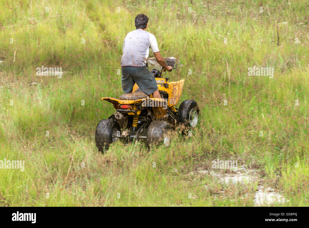 Man on quad with helmet hi-res stock photography and images - Alamy