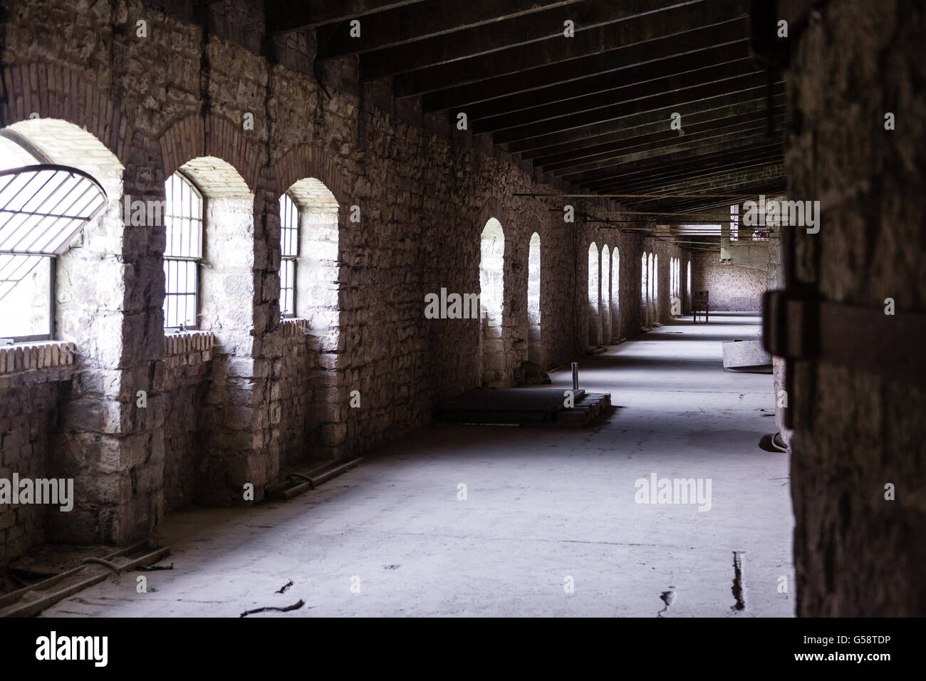 Inside old industrial building dark hi-res stock photography and images ...