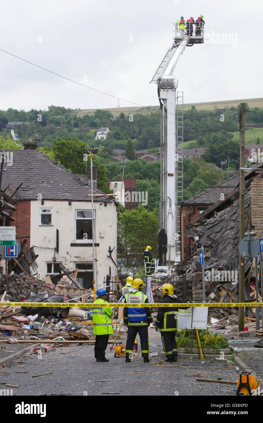 Emergency workers survey the scene of a suspected gas blast in Buckley ...