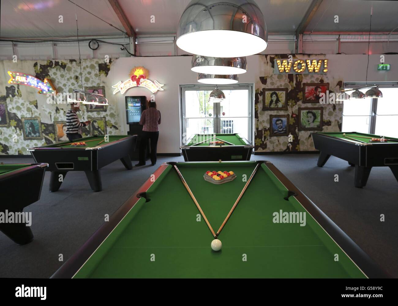 Pool tables are seen in the Globe bar in the Olympic Village built for ...