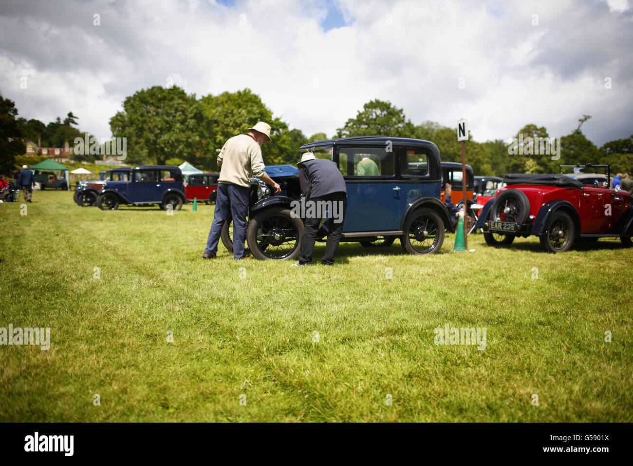 A judge closely inspects an entry at the 50th Austin Seven Rally at the ...