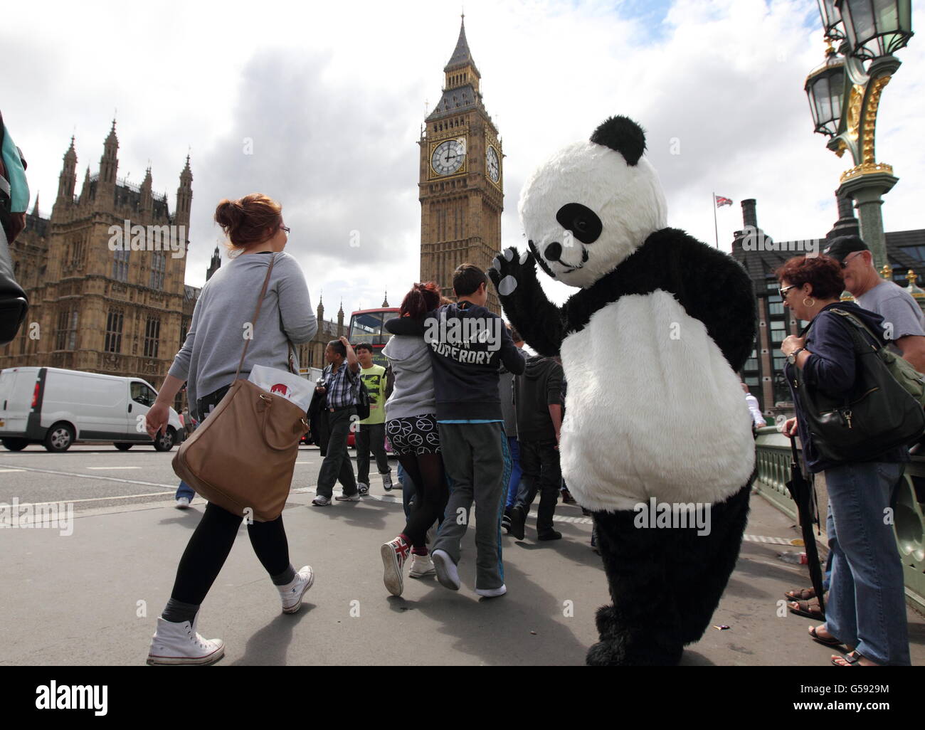 People dressed as pandas outside the Houses of Parliament, in central ...