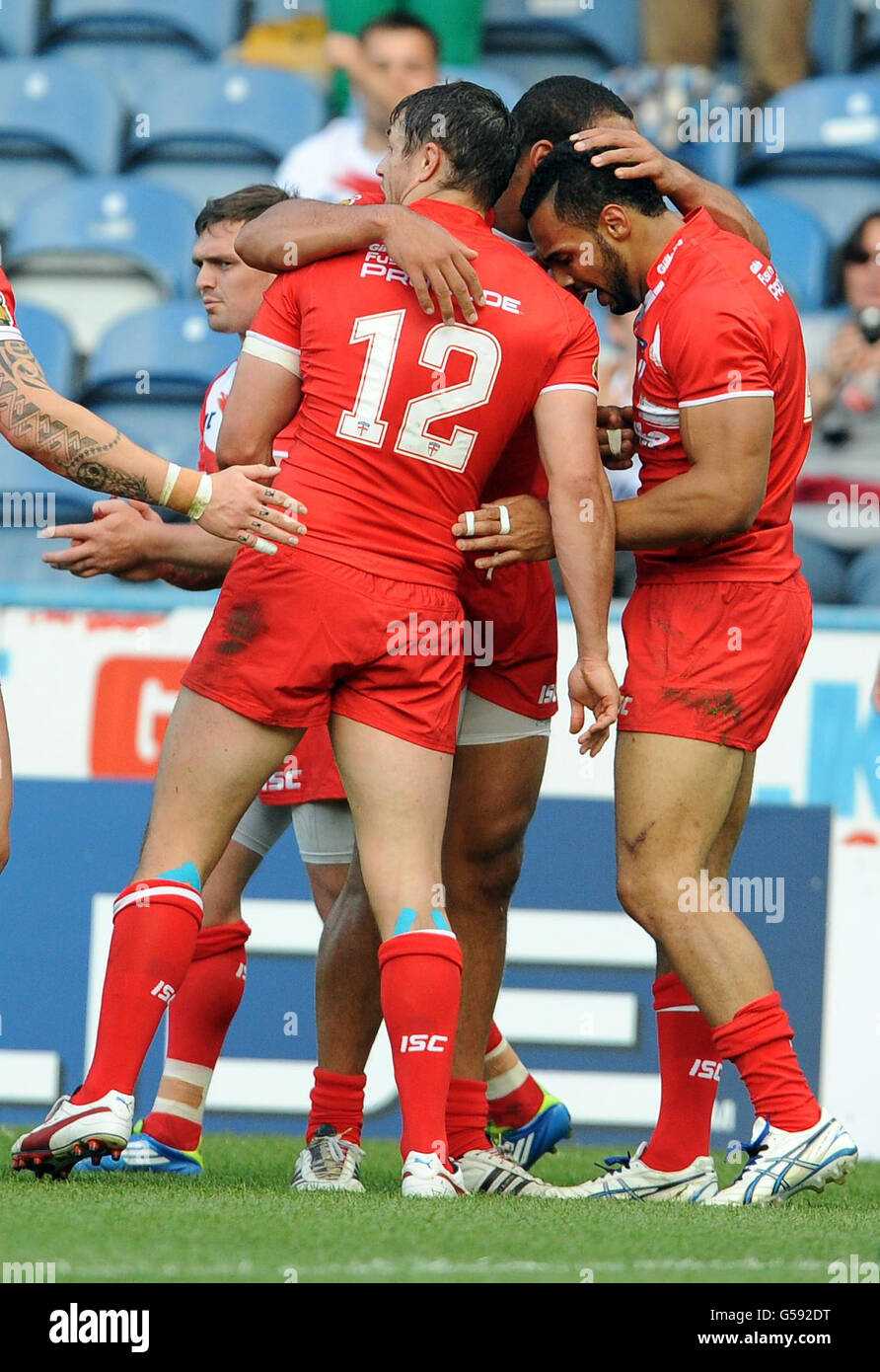 England's Ryan Atkins (right) is congratulated after scoring a try ...