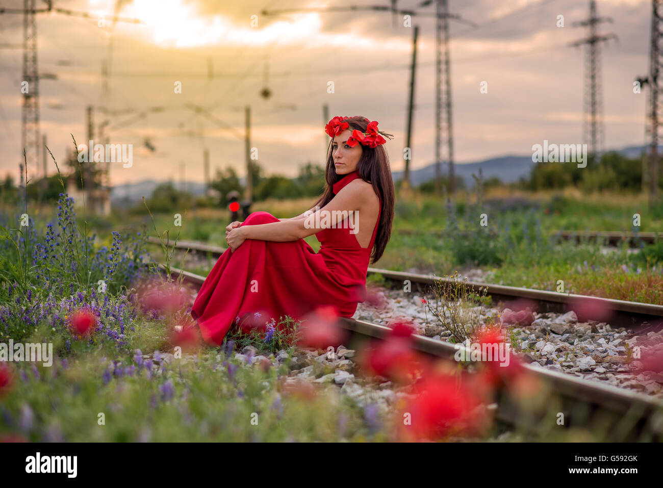 young girl with a beautiful dress on railroad tracks Stock Photo - Alamy