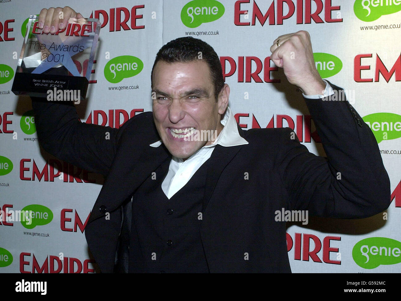 Footballer turned actor Vinnie Jones with his 2001 Empire Film Award ...