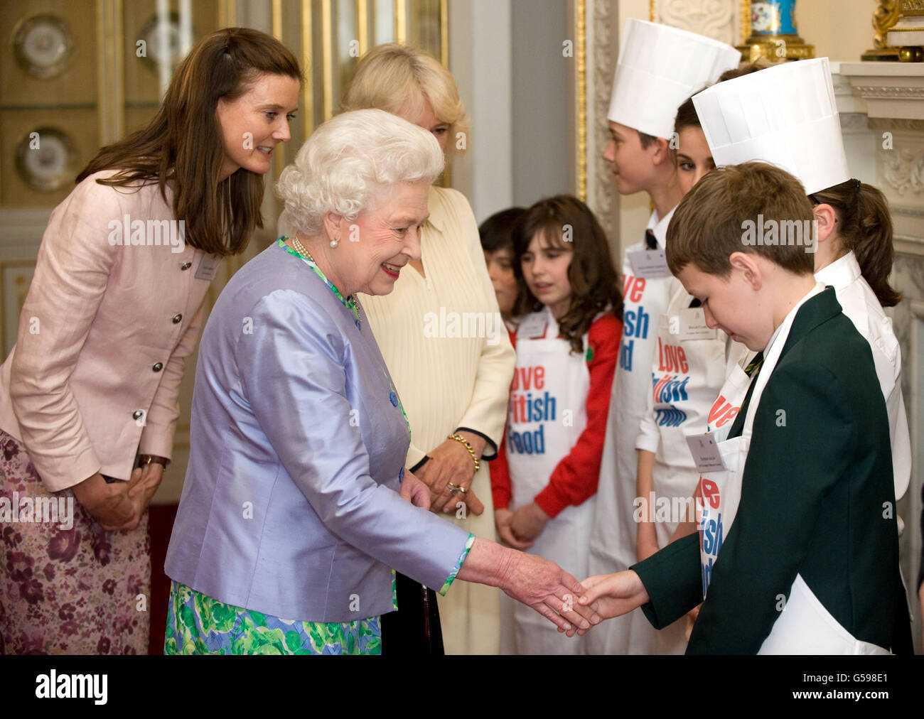 Queen Elizabeth II and The Duchess of Cornwall meet pupils at a ...