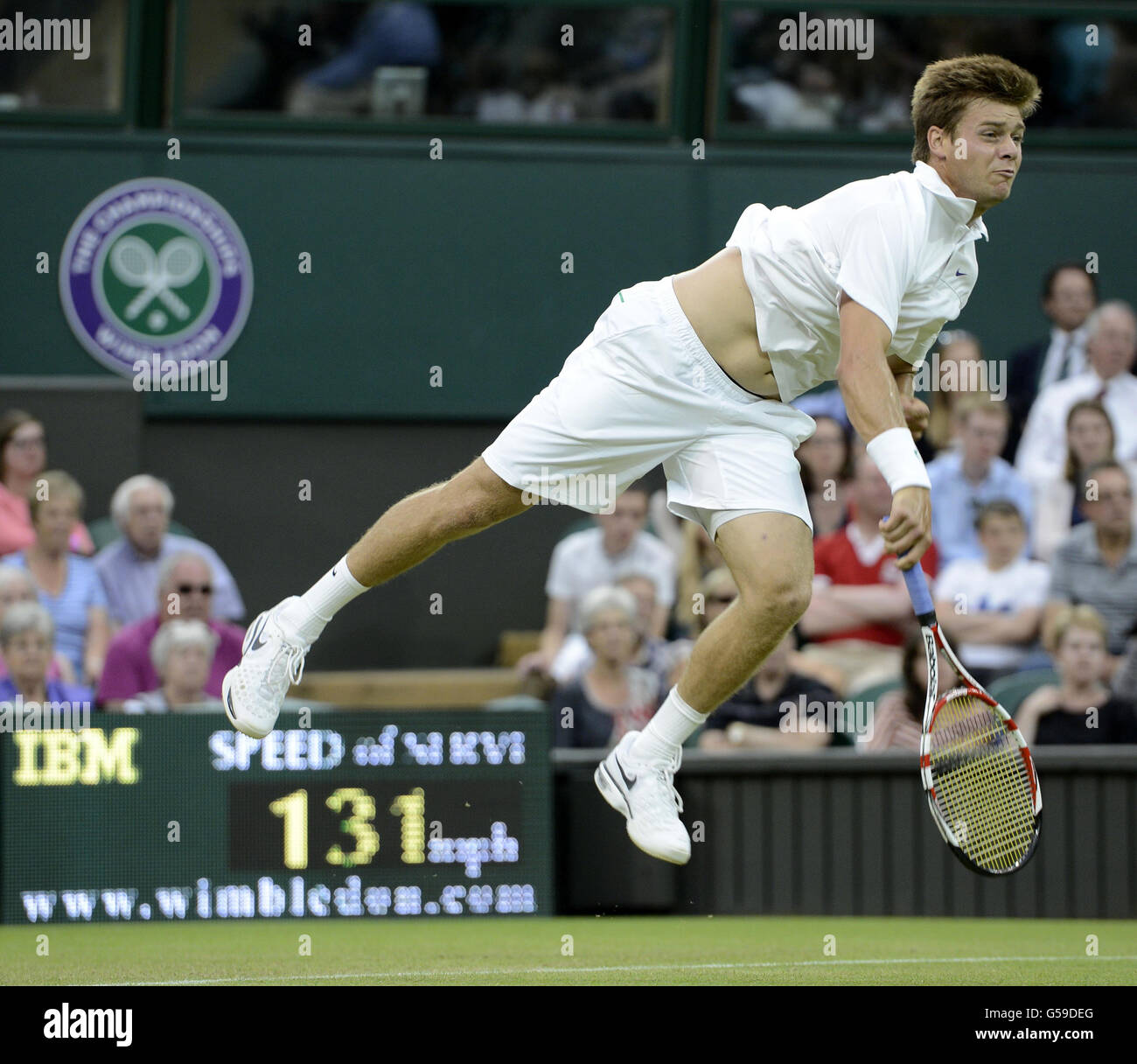 USA's Ryan Harrison in action against Serbia's Novak Djokovic during ...