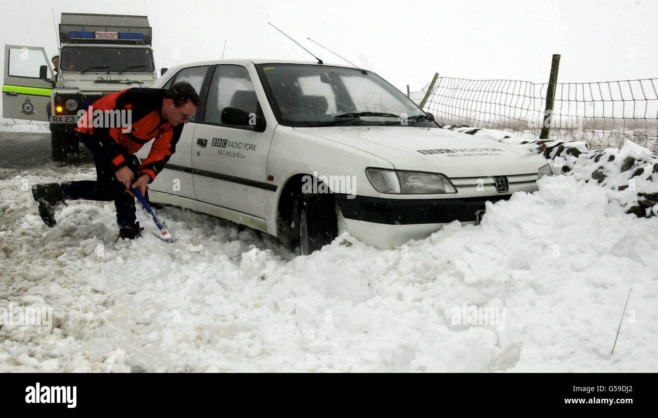 An RAF Mountain Rescue team rescue a stranded car near Buckden, North ...