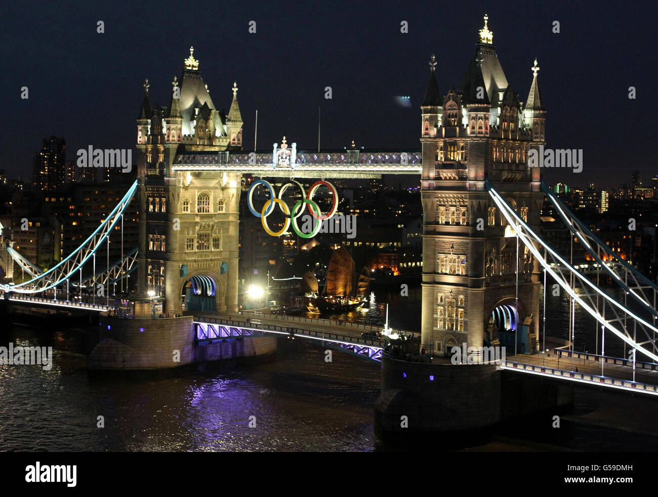The Olympic rings are lit up on Tower Bridge, London, in preparation ...