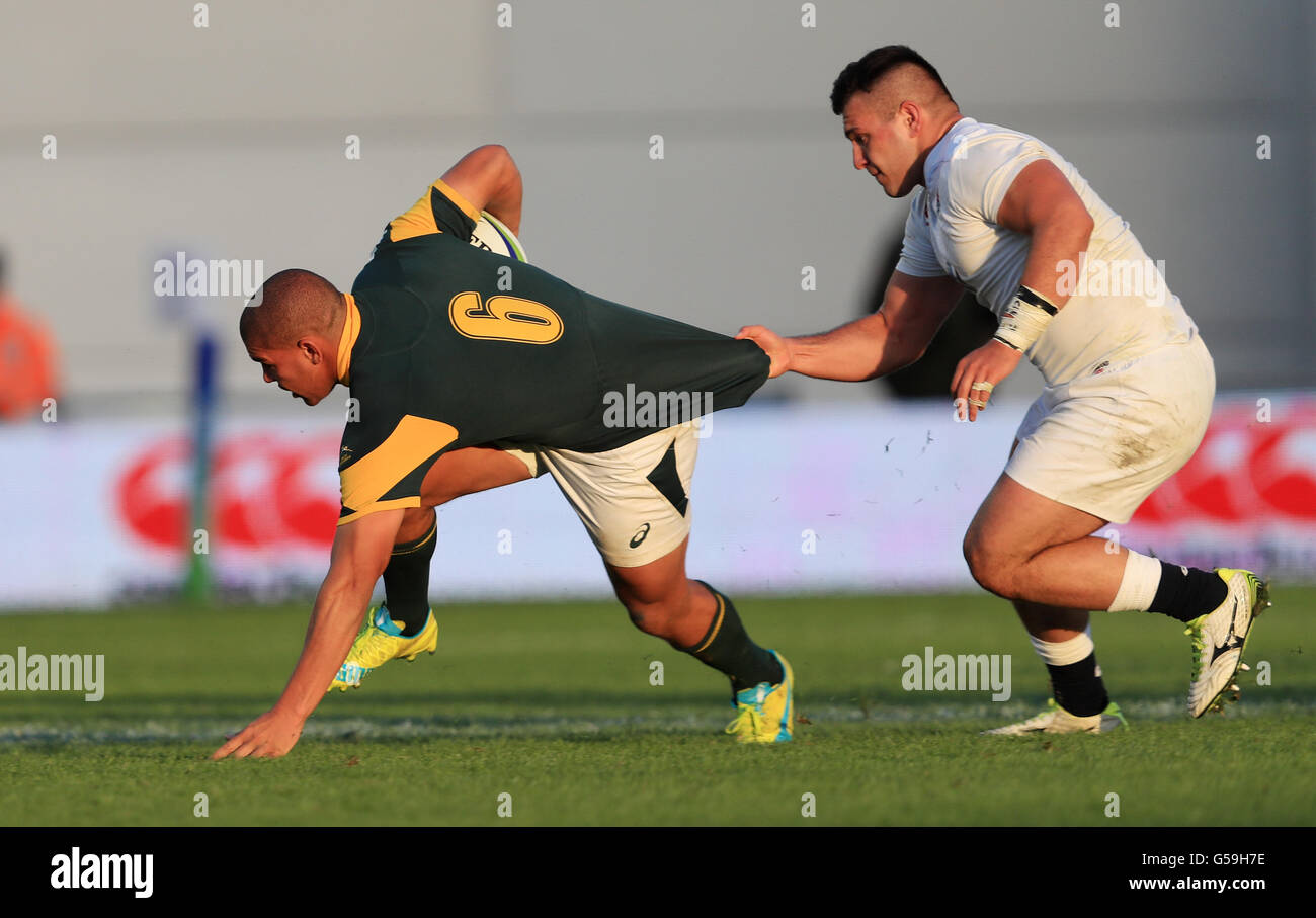 South Africa's Zain Davids is tackled by England's Lewis Boyce during ...